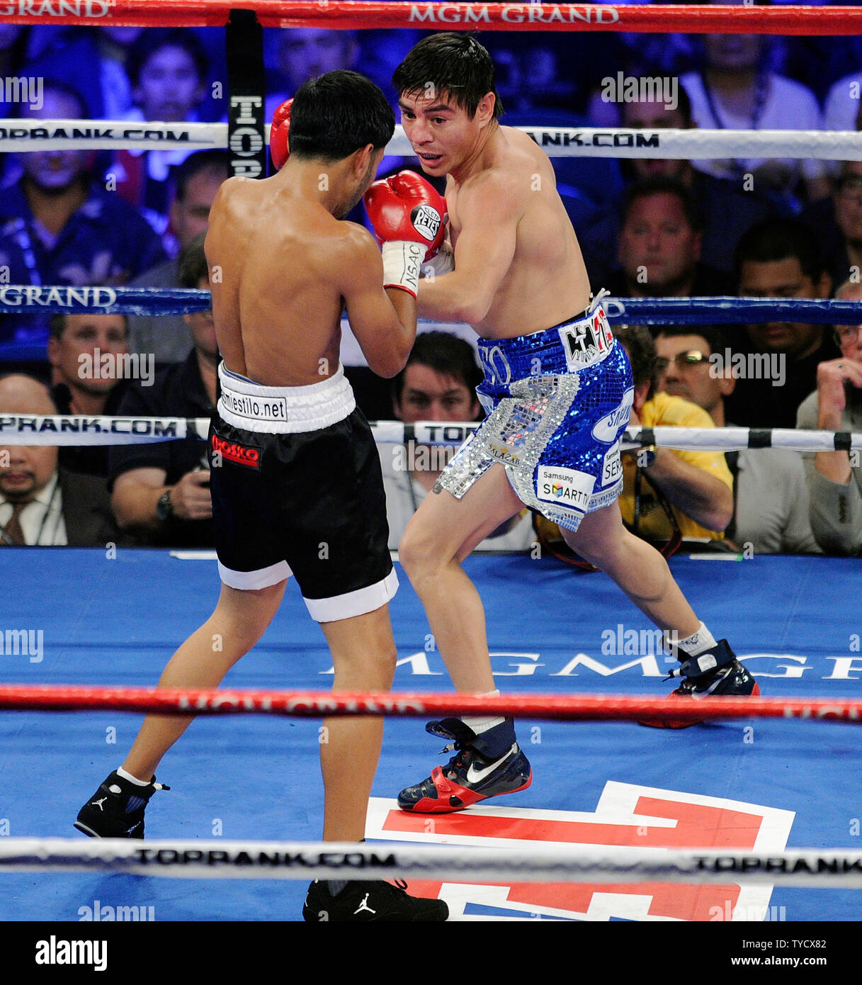 Boxers Jorge Arce of Mexico, right, and Jesus Rojas of Puerto Rico ...