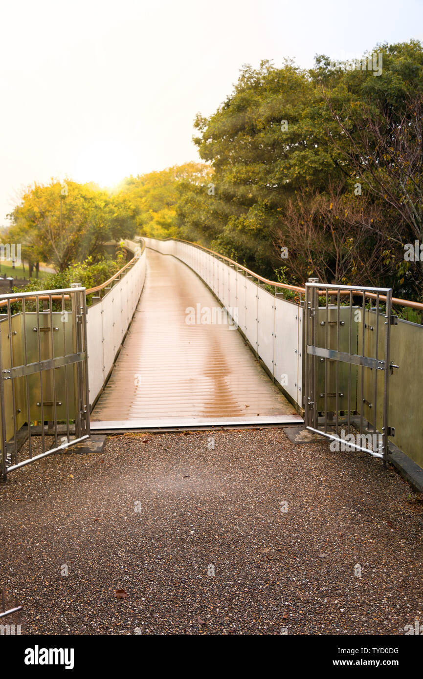 Narrow walkway after rain Stock Photo - Alamy