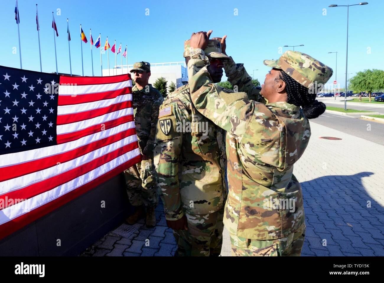 U.S Army 1st Sgt. Ta Mouton Pins Staff Sgt. Brian K. Martin during a ...