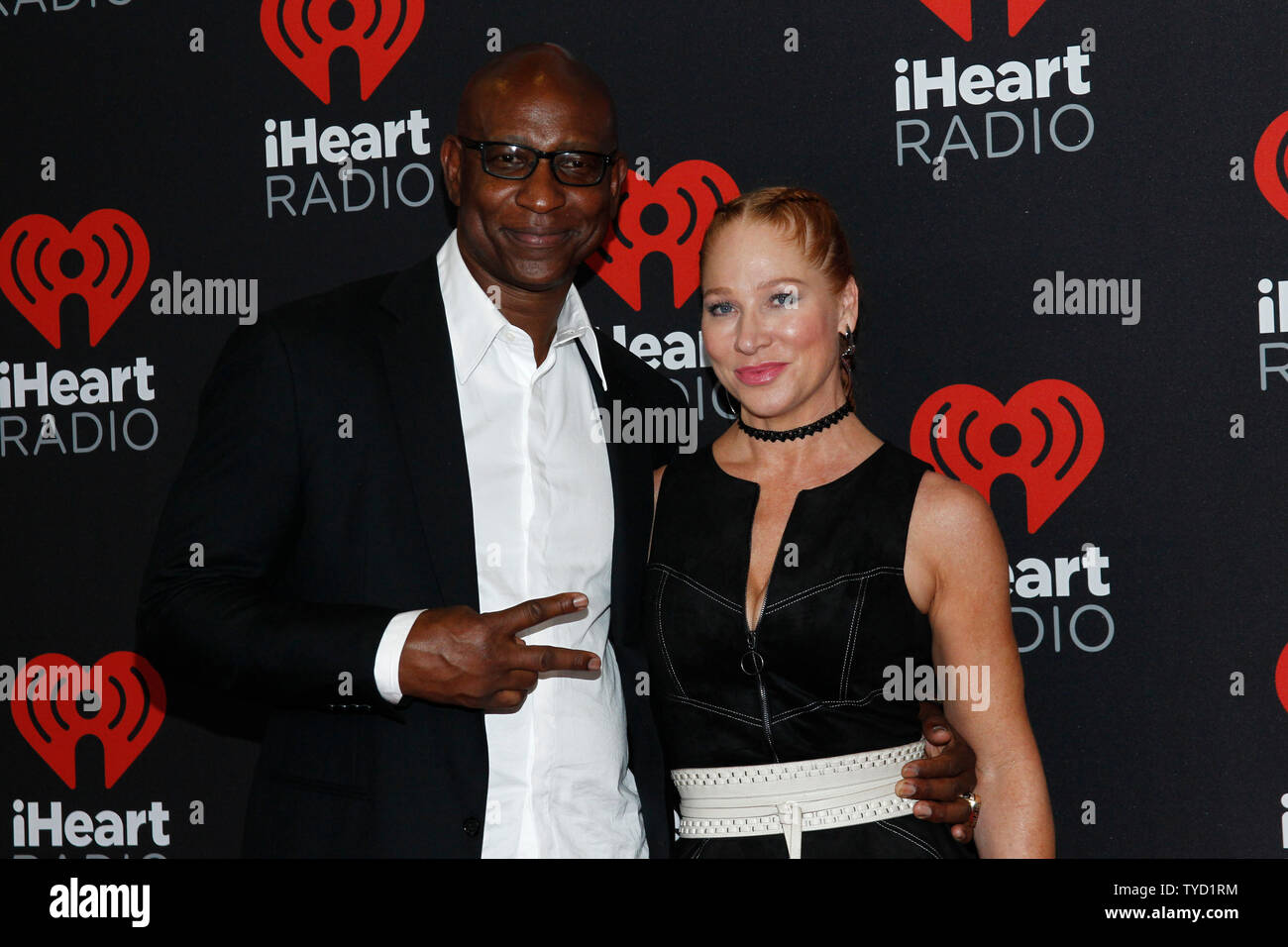 NFL legend Eric Dickerson and his wife Penny Sutton arrive for the ...