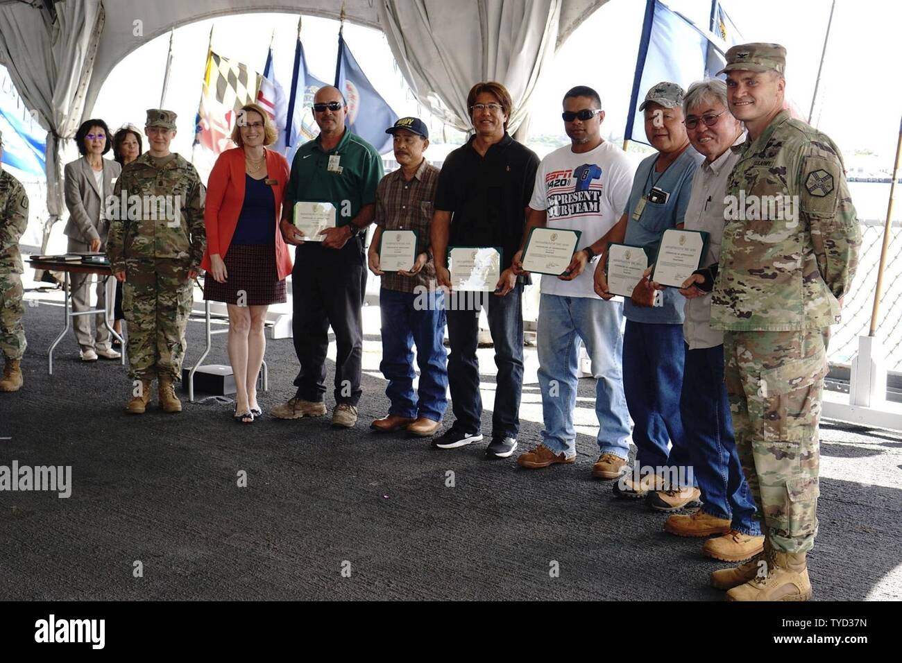 Members of the Department of Public Works who received an award pose ...