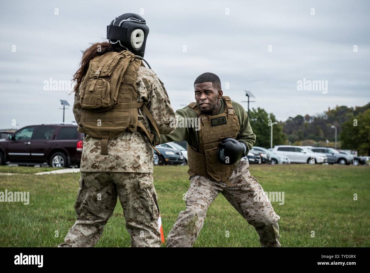 Marine Sgt. Kenneth Eaton spars with Marine Private First Class Jasmine ...