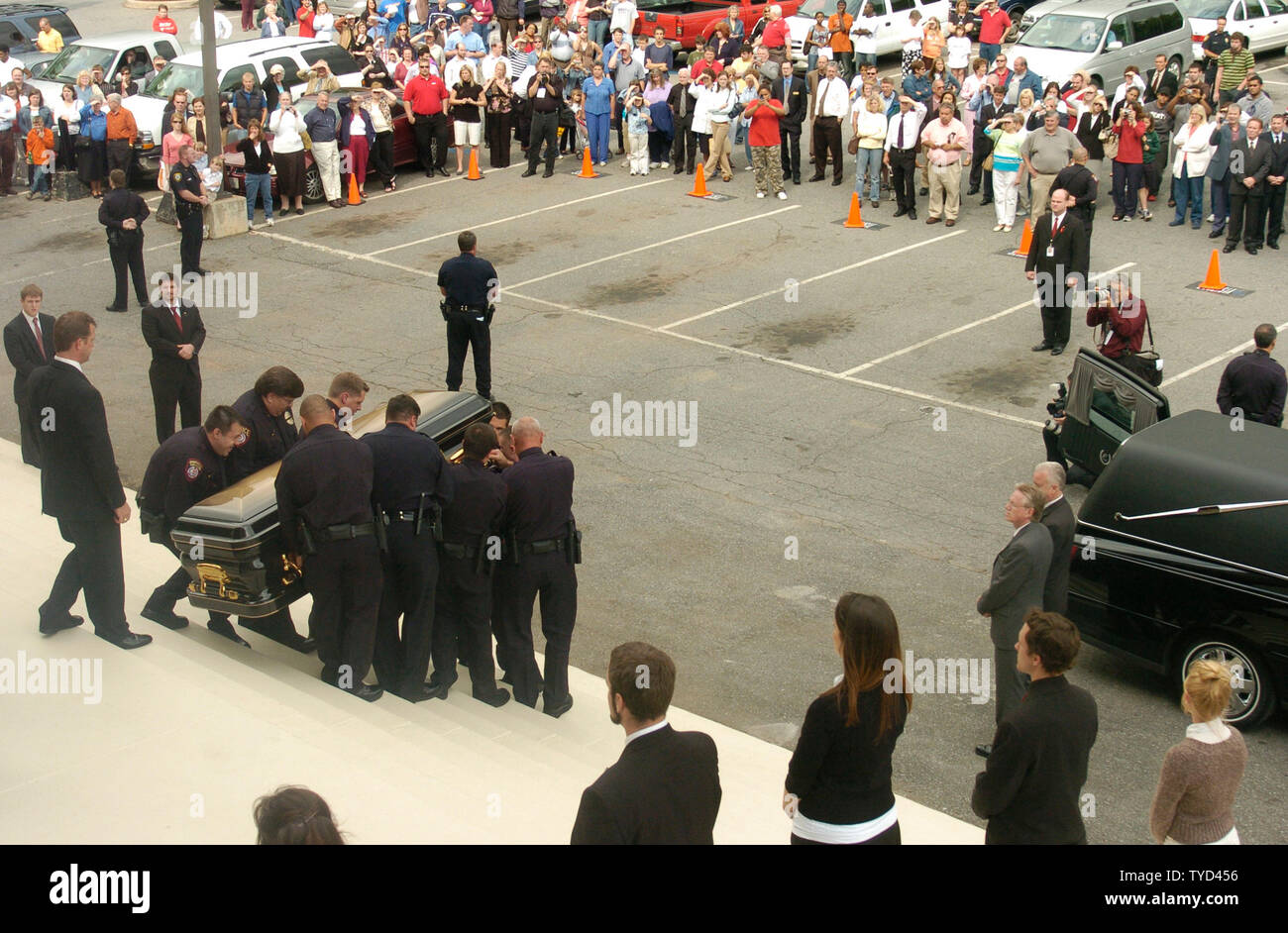 The casket of Rev. Jerry Falwell is carried by a police honor guard ...