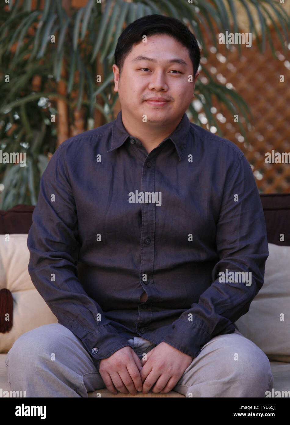 Director Zhang Chi arrives at a photocall for the film "The Shaft ...