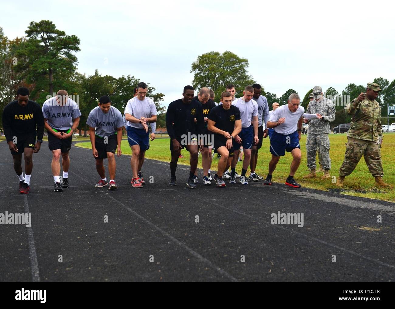 U.S. Air Force Airmen, U.S. Army Soldiers and U.S. Navy Sailors take ...