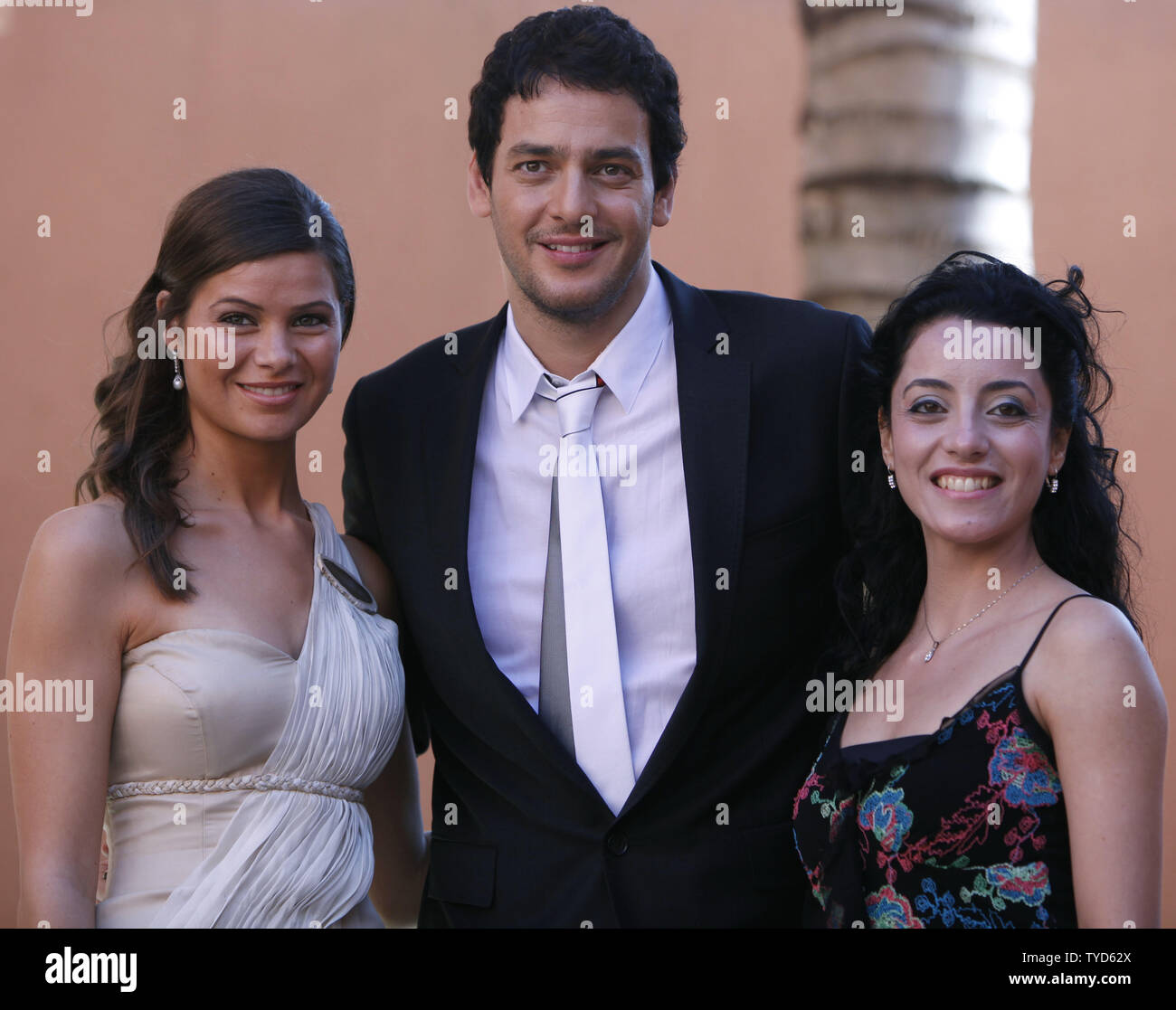 Actress Yosra El Lozy (L), actor Khaled Abol Naga (C) and actress Aya Soliman arrive at a ...
