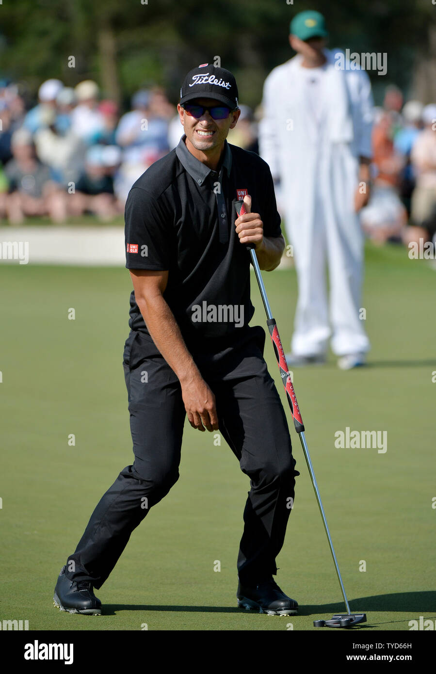 Adam Scott reacts after missing a putt using his belly putter on the ...