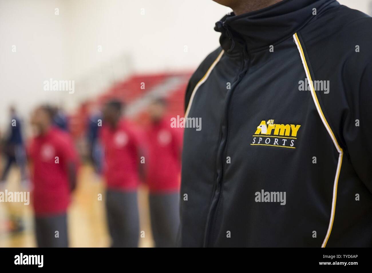 A U.S. military member of the All Army basketball team wears a jacket ...