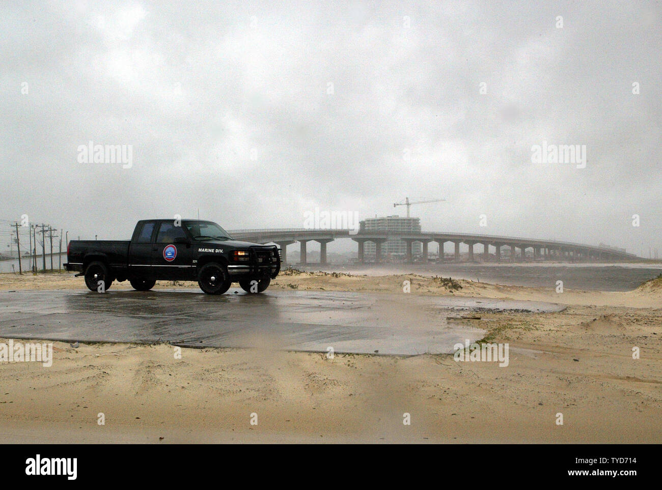 A police truck patrols Orange Beach, Alabama as Hurricane Dennis make ...