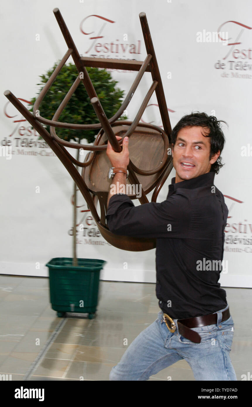 Actor Filip Nikolic of the French television show "Navarro" pretends to ...