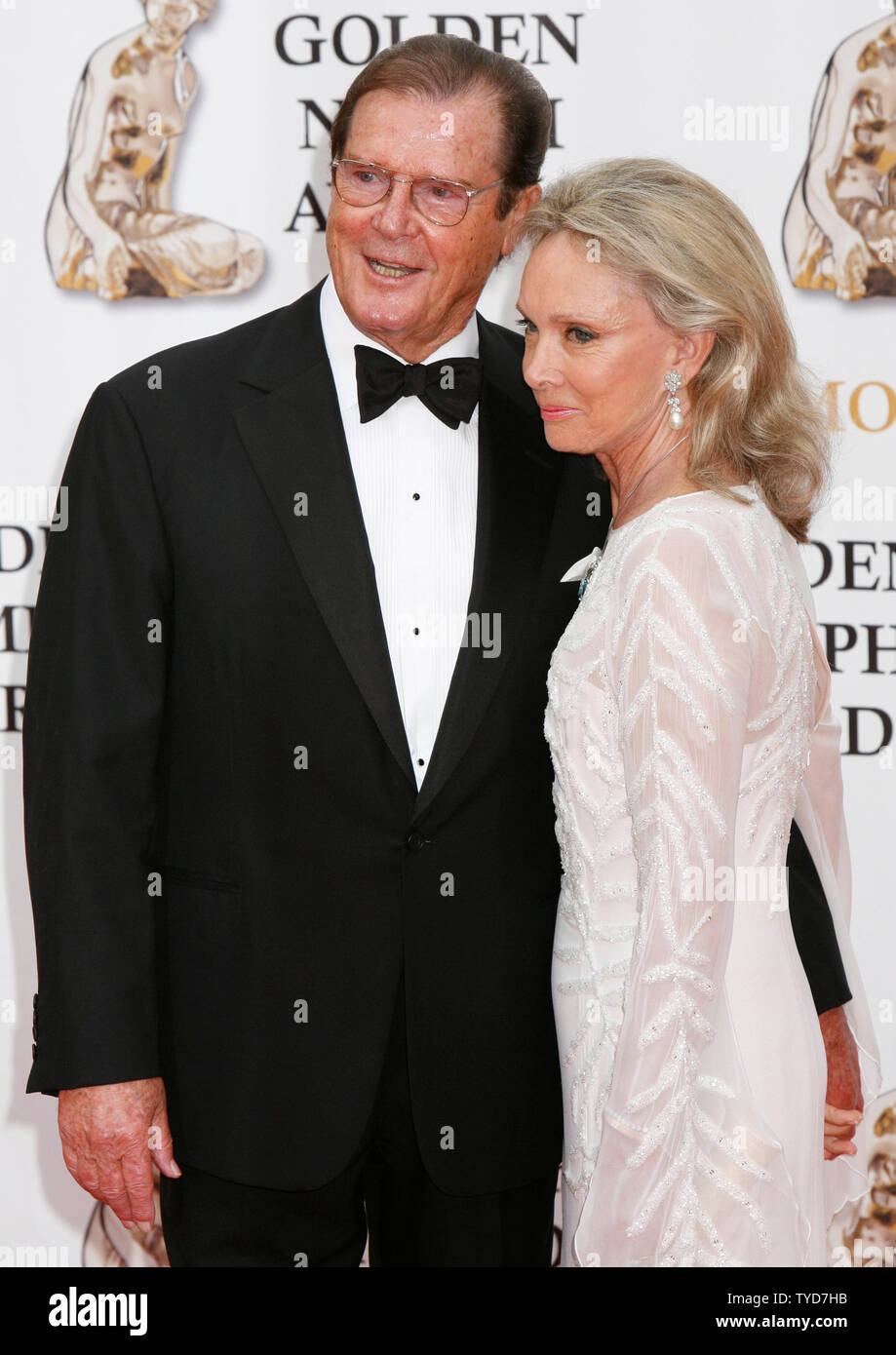 Actor Roger Moore and his wife Kiki arrive on the red carpet for the ...