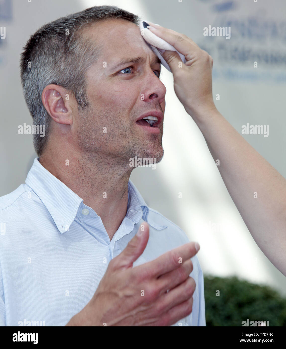 Actor Rob Estes receives last minute makeup before a photocall for the ...