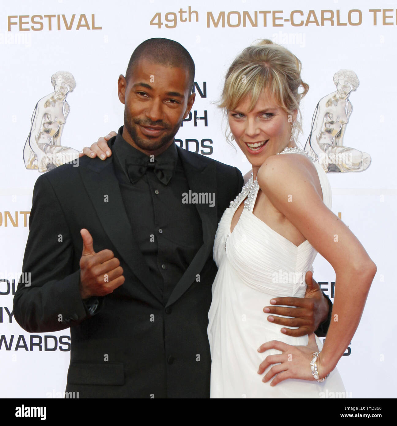 Actor Tyron Ricketts (L) and guest arrive on the red carpet before the ...