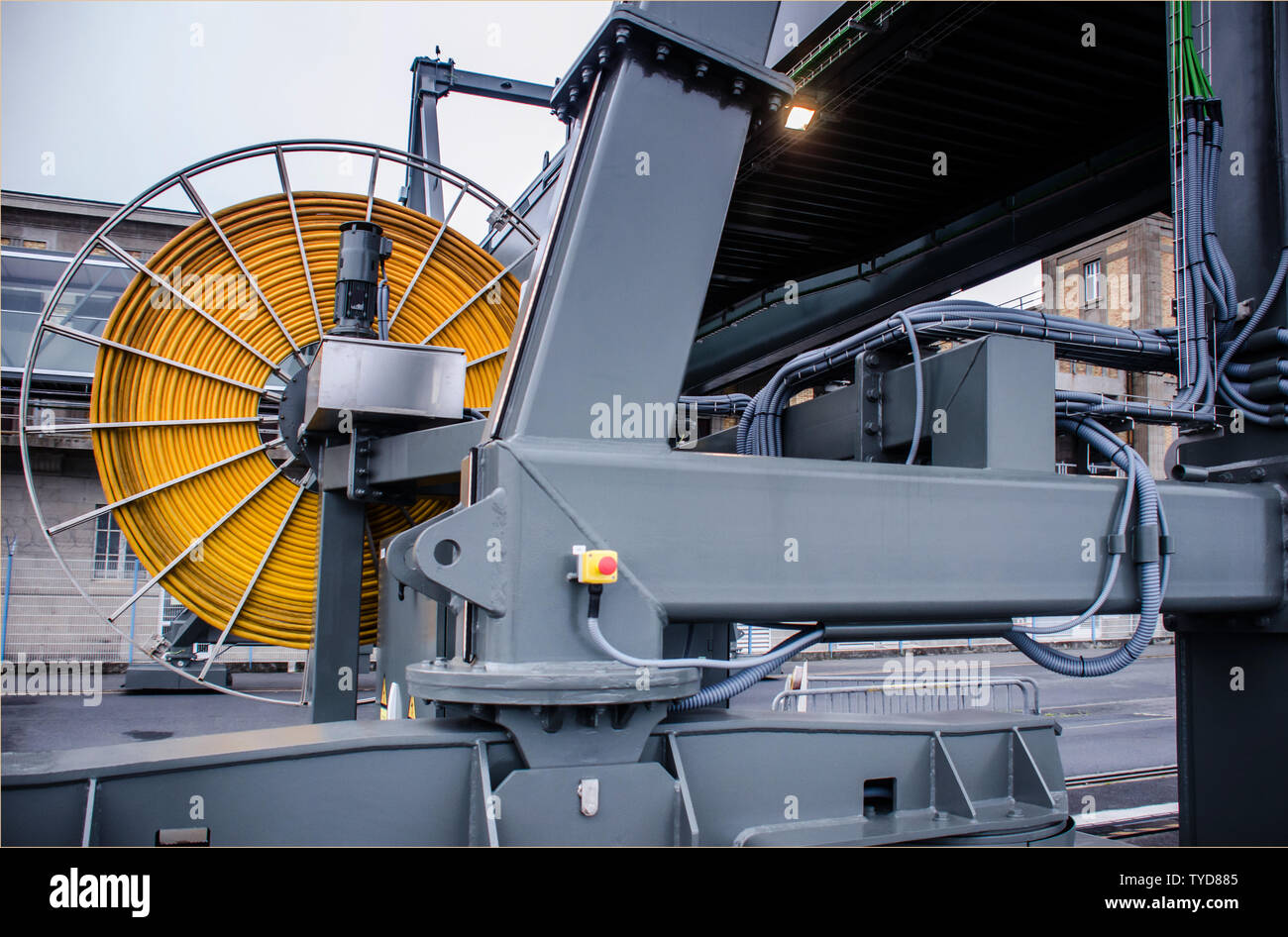 Cable drum with yellow wire. Mobile gangway for cruise ships in the ...