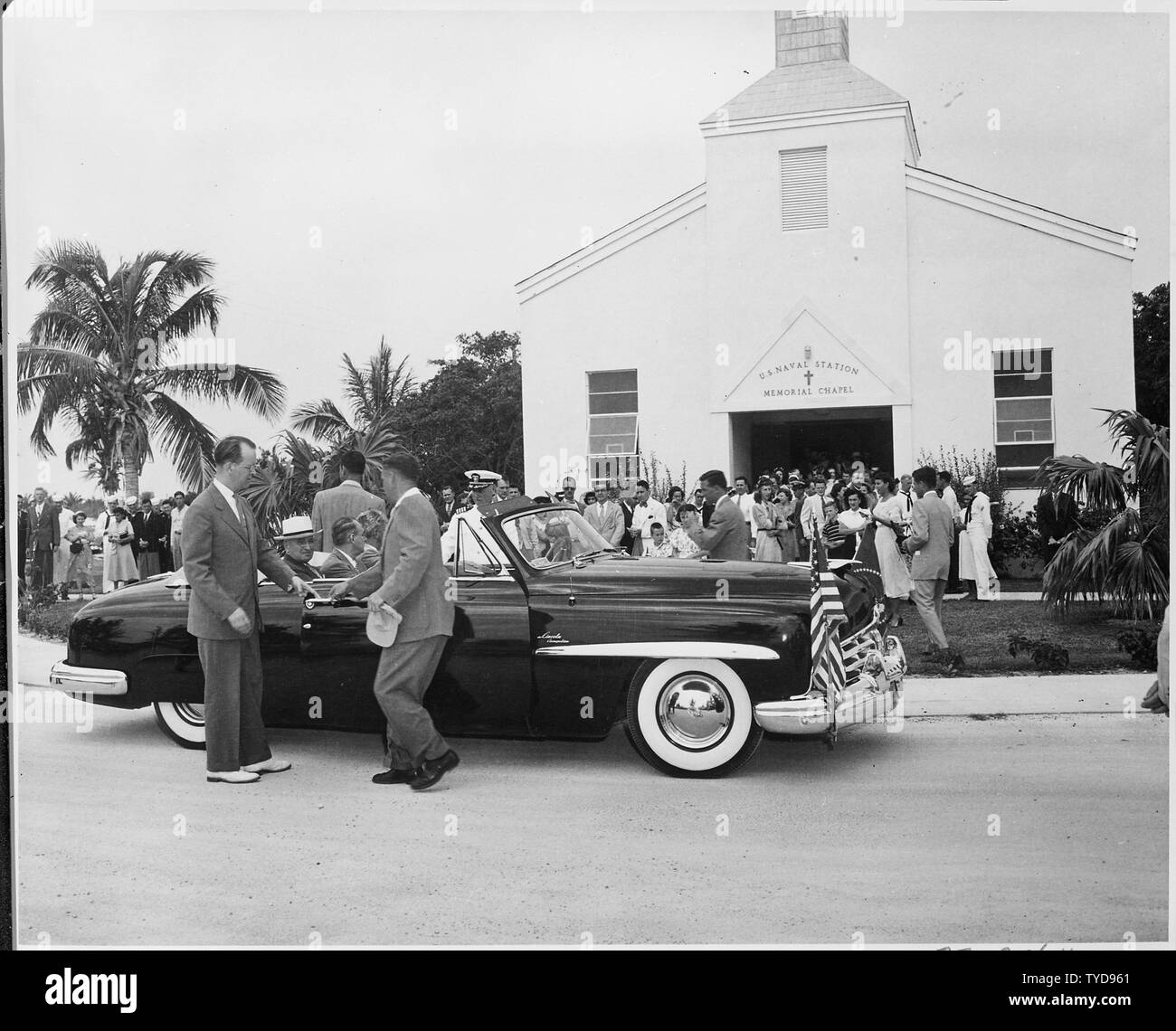 Photograph of President Truman arriving in his limousine to attend ...