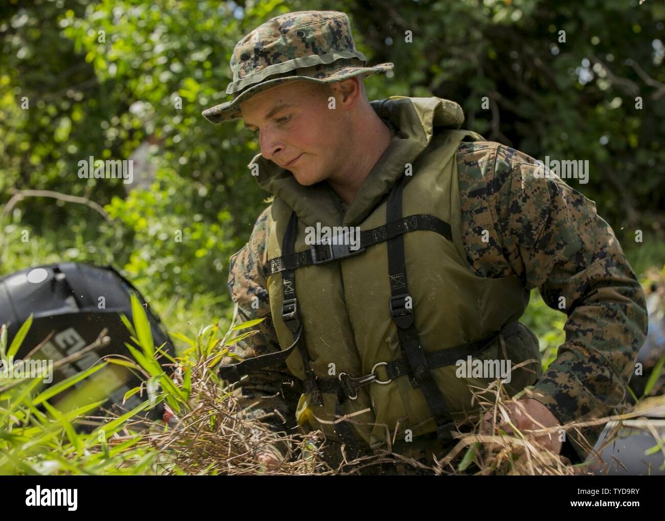 U.S. Marine Cpl. Jared Burns covers a Combat Rubber Reconnaissance ...