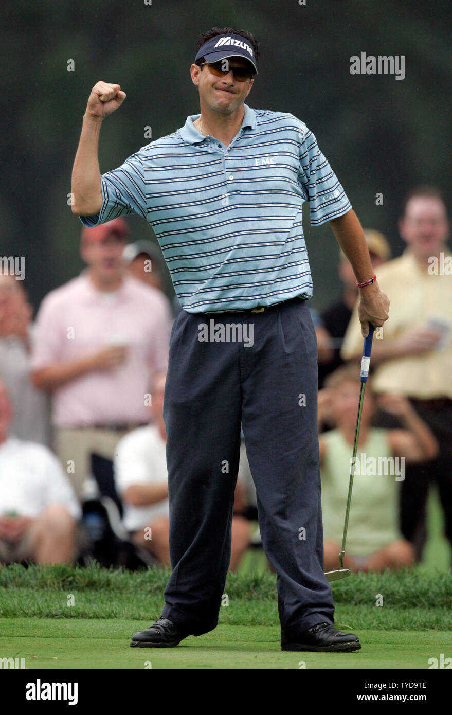 Billy Andrade celebrates a long putt to save par on the 14th green ...