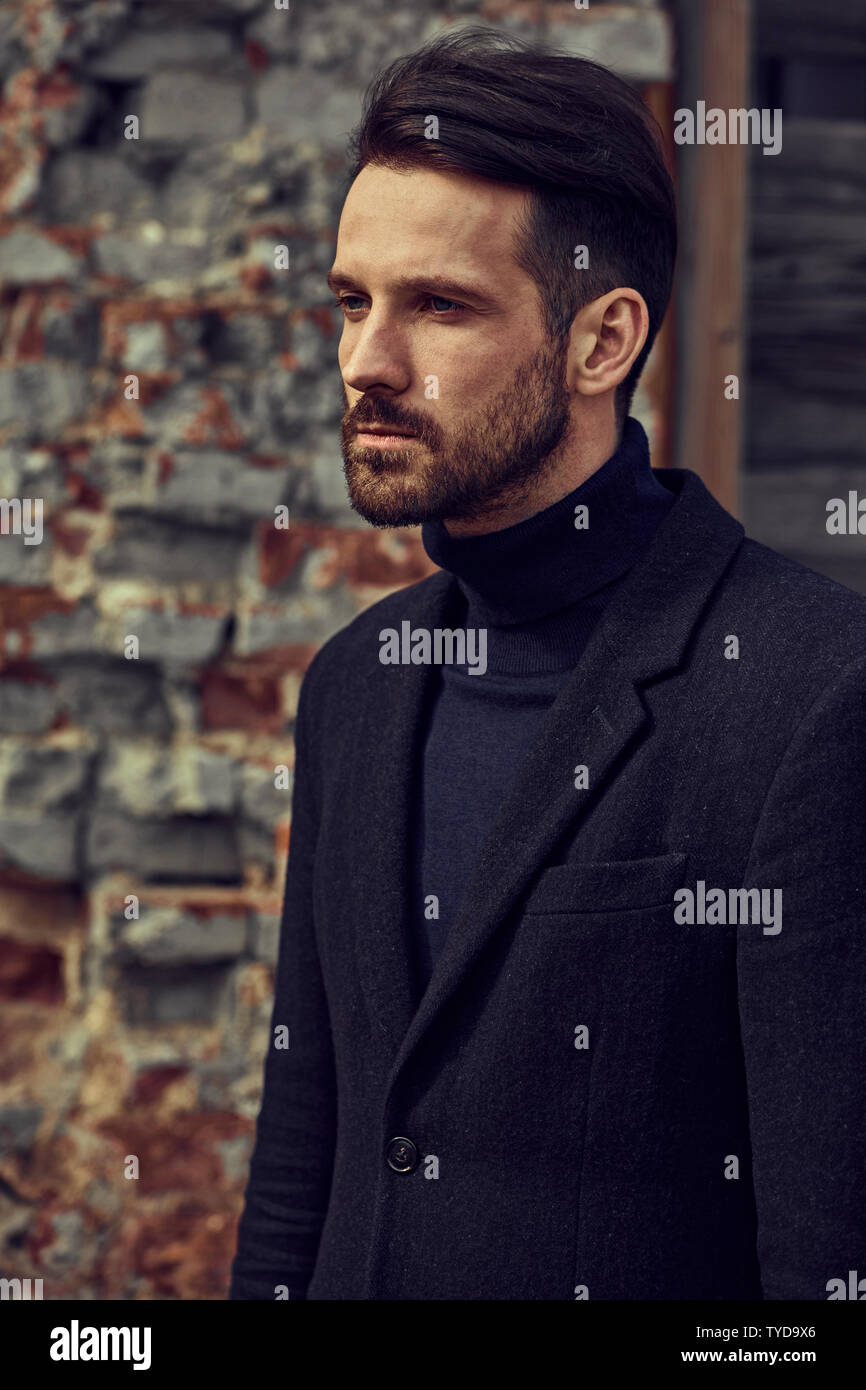 Fashion beard sad handsome male model in trouble posing in style ...