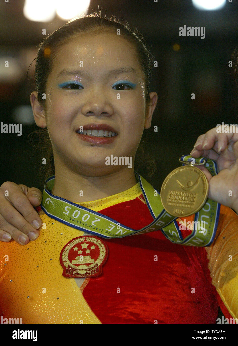 Chinese gymnast Fei Cheng holds her gold medal from the women's vault ...