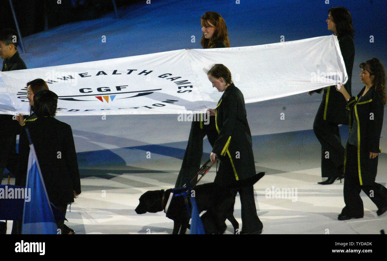 The Commonwealth Games Federation flag is carried in at the Melbourne ...