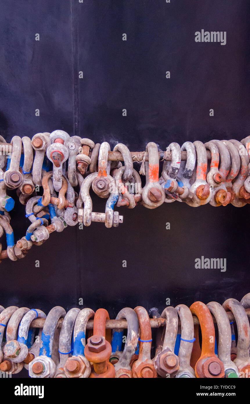 Storage of old rusty shackles. Metallic connectors for chains and ropes ...
