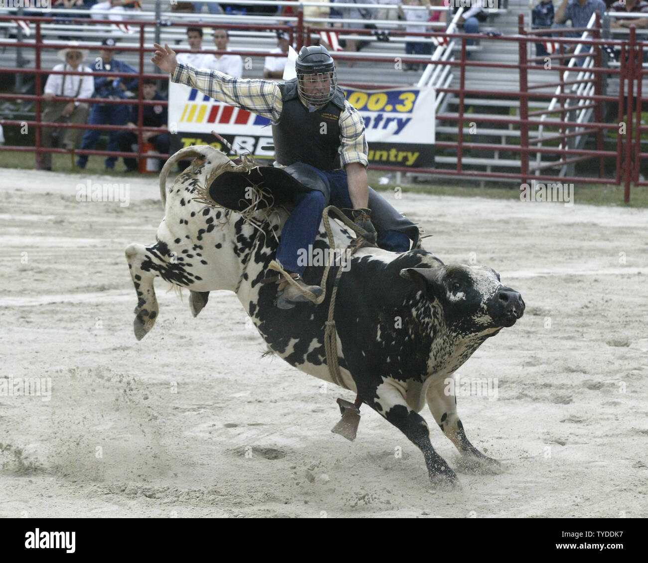 Matthew Parton competes in the bull riding event, at the Homestead ...