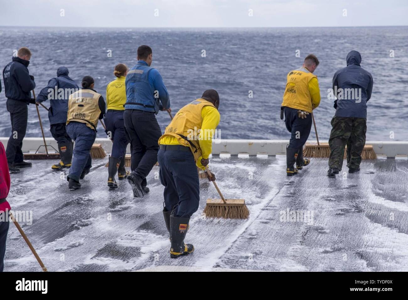 EAST CHINA SEA (Nov. 2, 2016) Sailors scrub the flight deck of ...