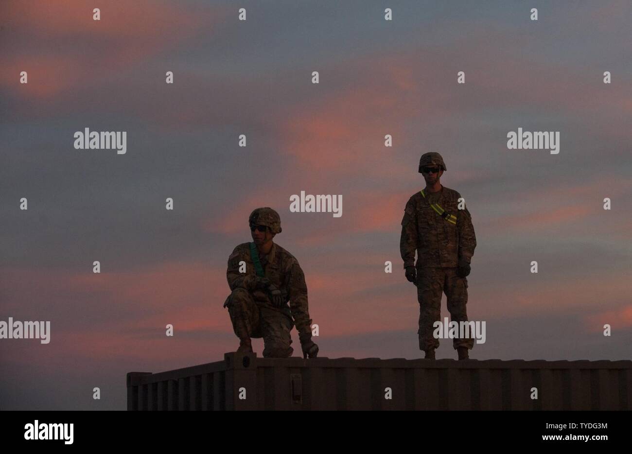 U.S. Army Staff Sgt. Joseph Harris (left) and Private 1st Class ...