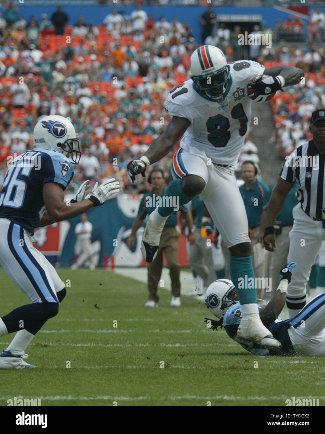 Miami Dolphins tightend Randy McMichael (81) leaps a tackler against ...