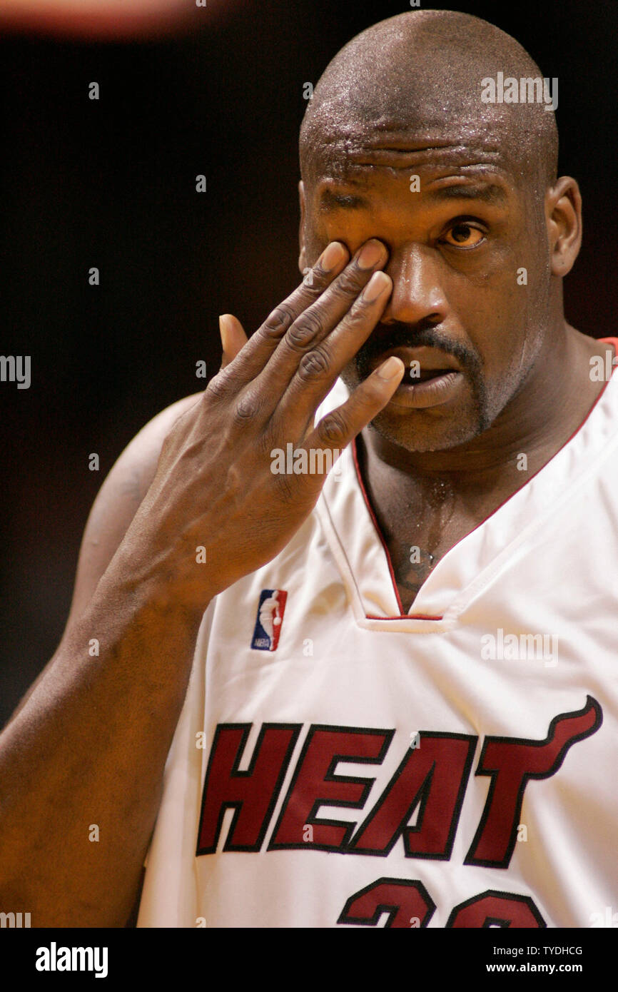Miami Heat center Shaquille O'Neal nurses his eye after getting fouled ...