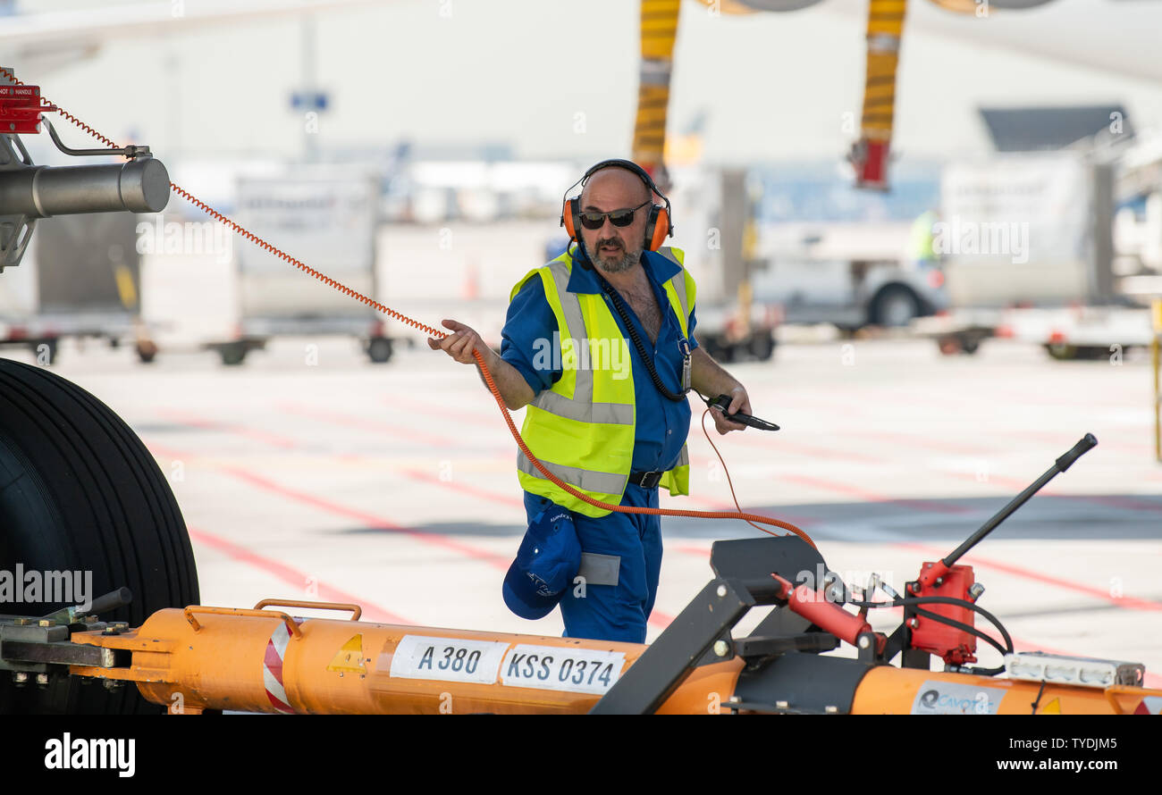 26 June 2019, Hessen, Frankfurt/Main: A Fraport employee is standing in ...