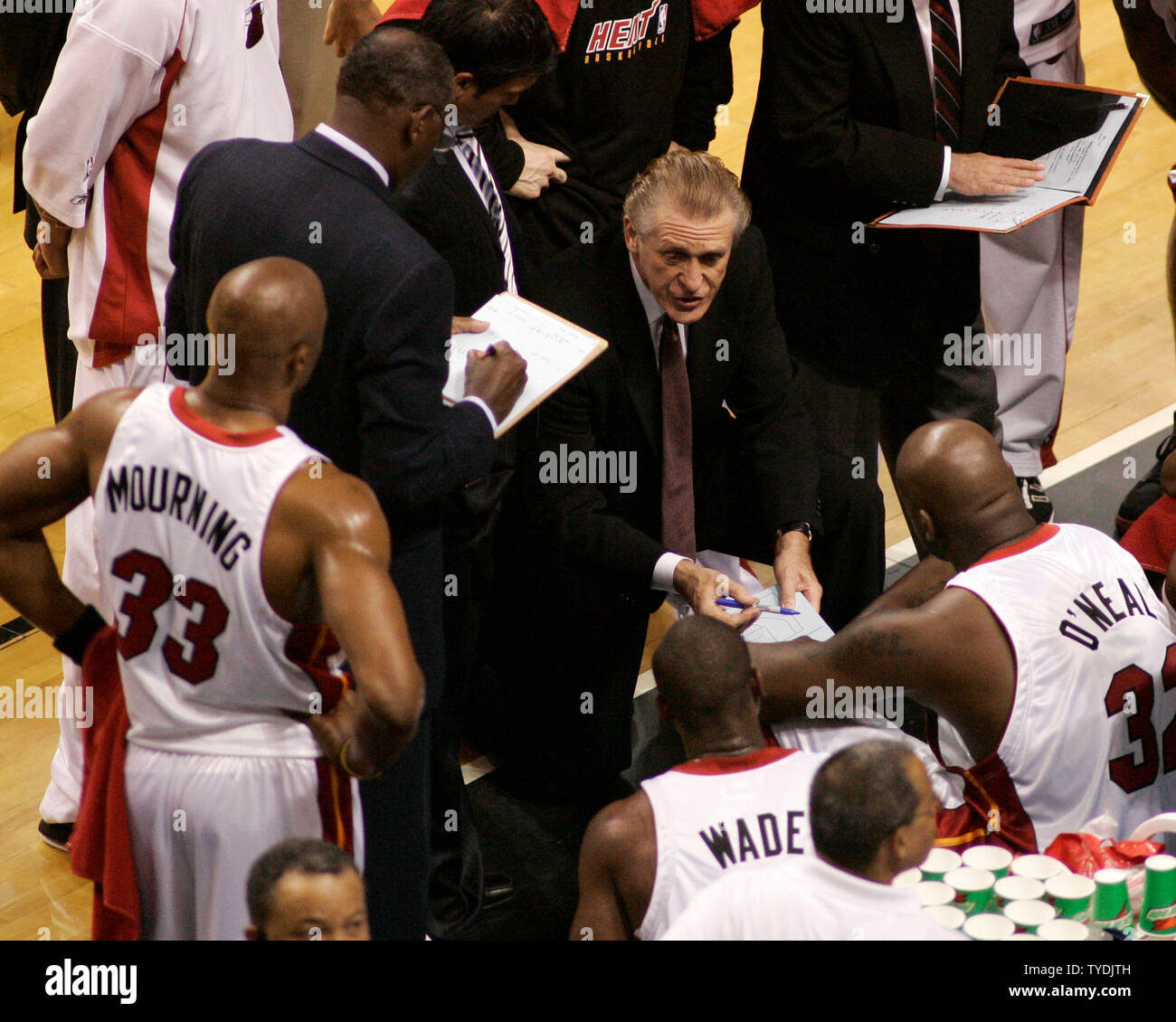 Miami Heat's coach Pat Riley talks to Shaquille O'Neal, Dwyane Wade and ...