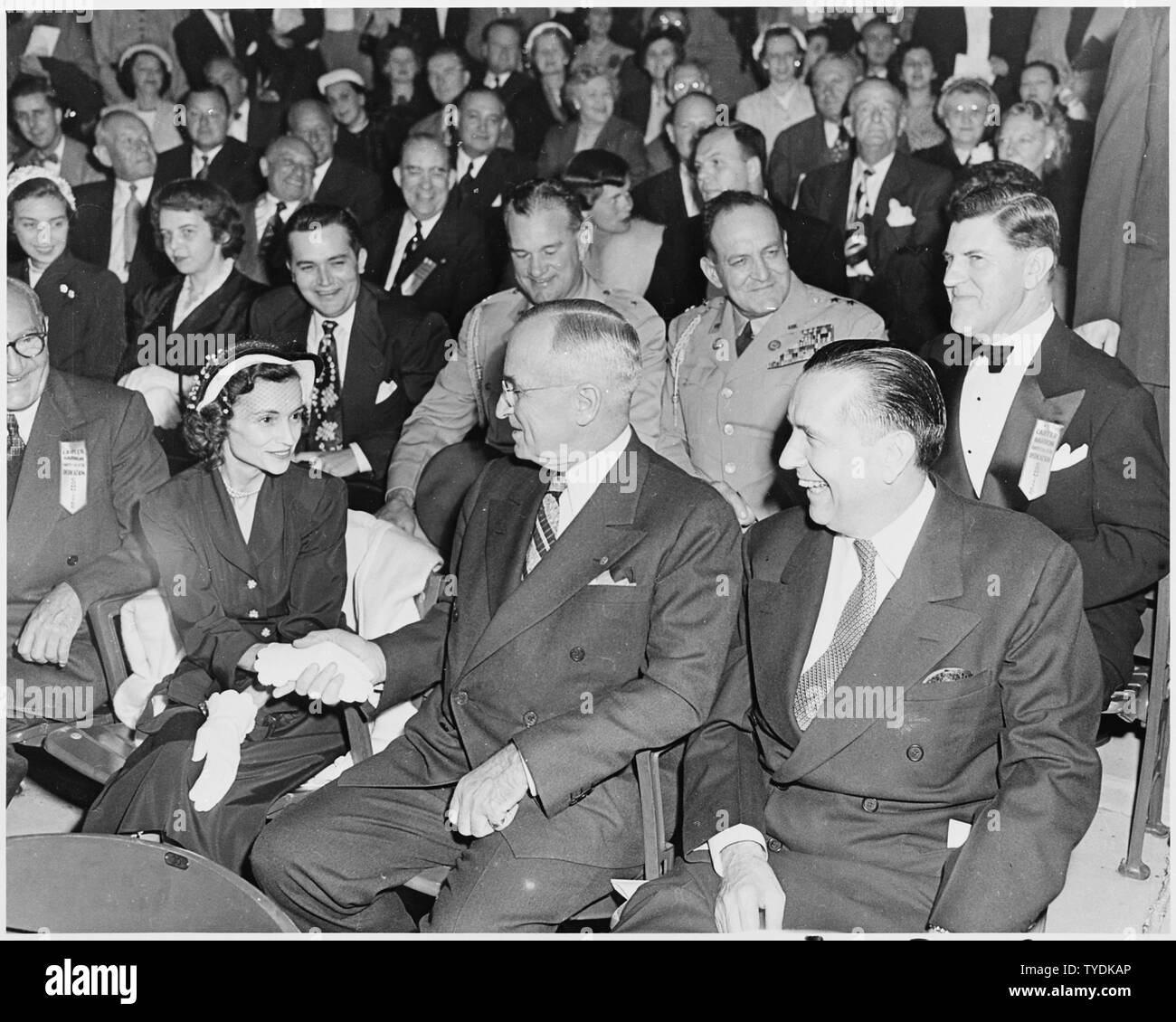 Photograph of President Truman shaking hands with an unidentified woman ...