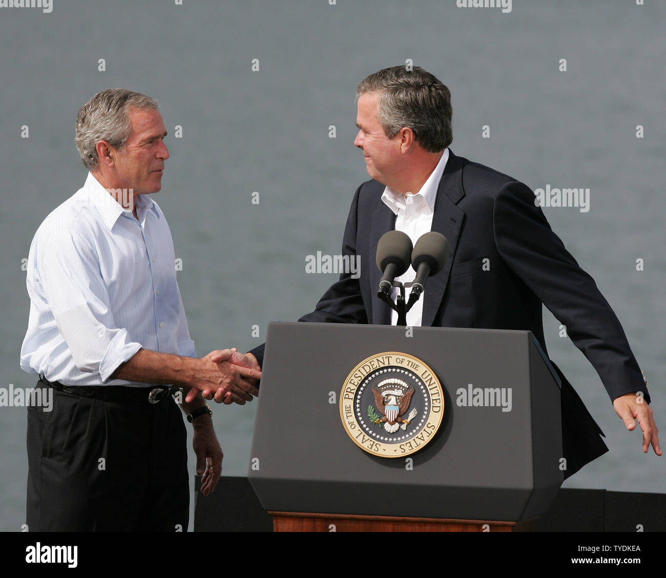 Florida Governor Jeb Bush (R) shakes hands with his brother U.S ...