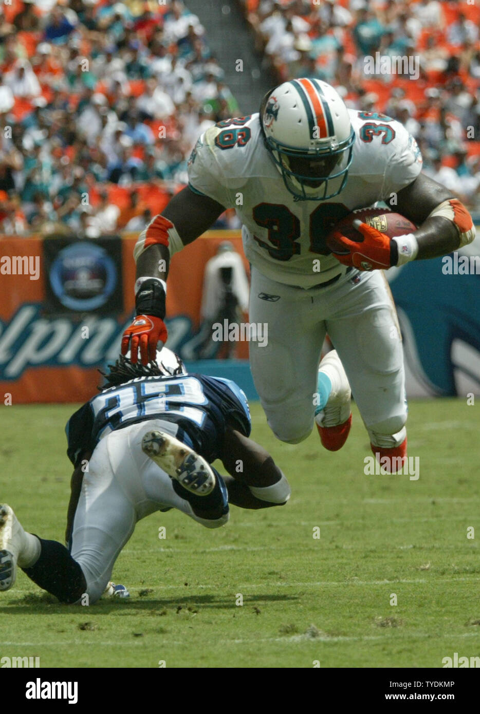 Miami Dolphins fullback Darian Barnes (36) leaps over the Tennessee ...