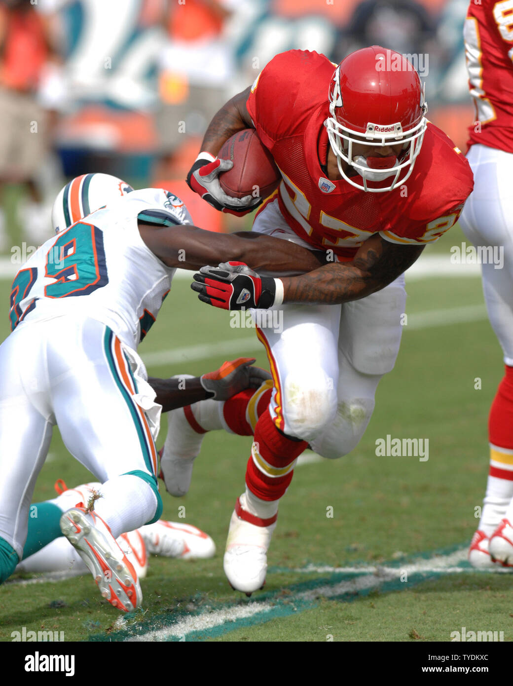 Kansas City Chiefs Larry Johnson makes a short gain before being ...