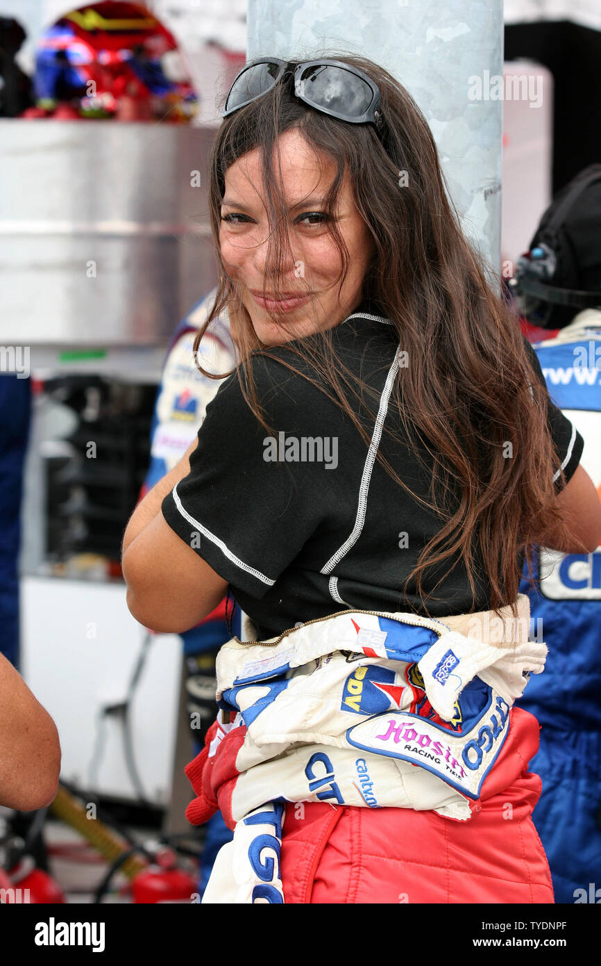 Milka Duno of Venezuela rests in her pit after changing drivers during ...