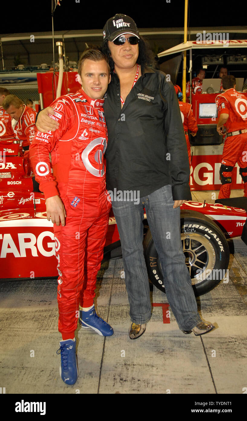 Dan Wheldon (L) and Gene Simmons visit prior to the start of the XM ...