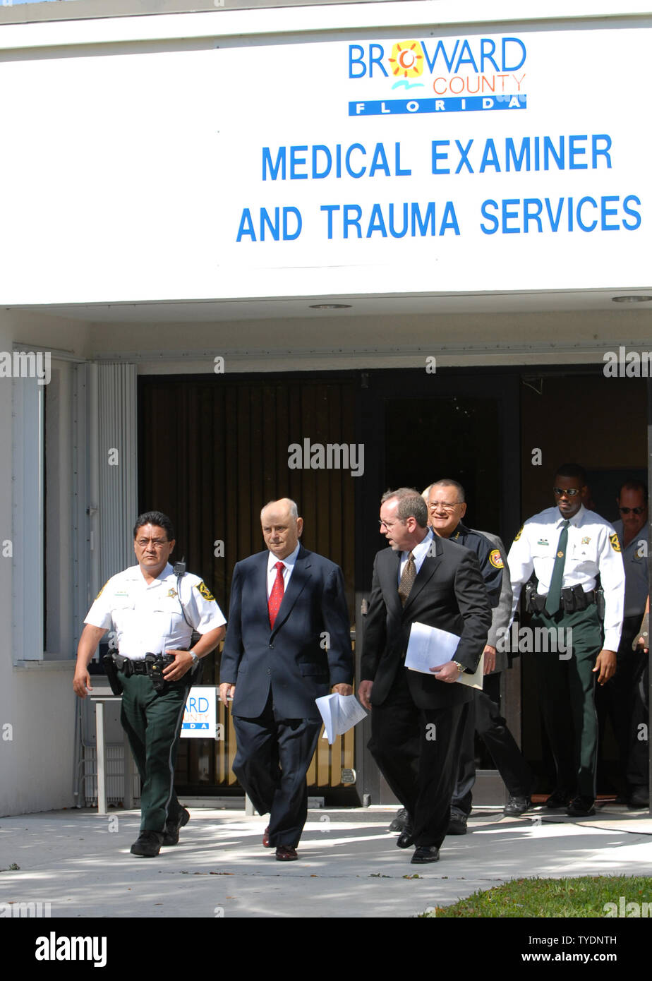 Broward County Medical Examiner Dr. Joshua Perper (second from left ...
