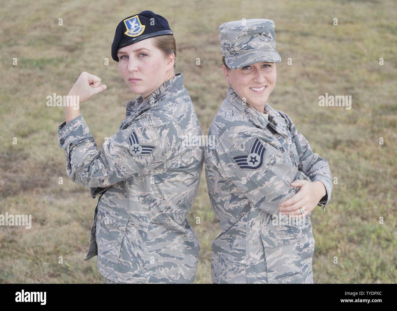Senior Airman Kaley Weir (left), 802nd Security Forces Squadron corrections specialist, and ...