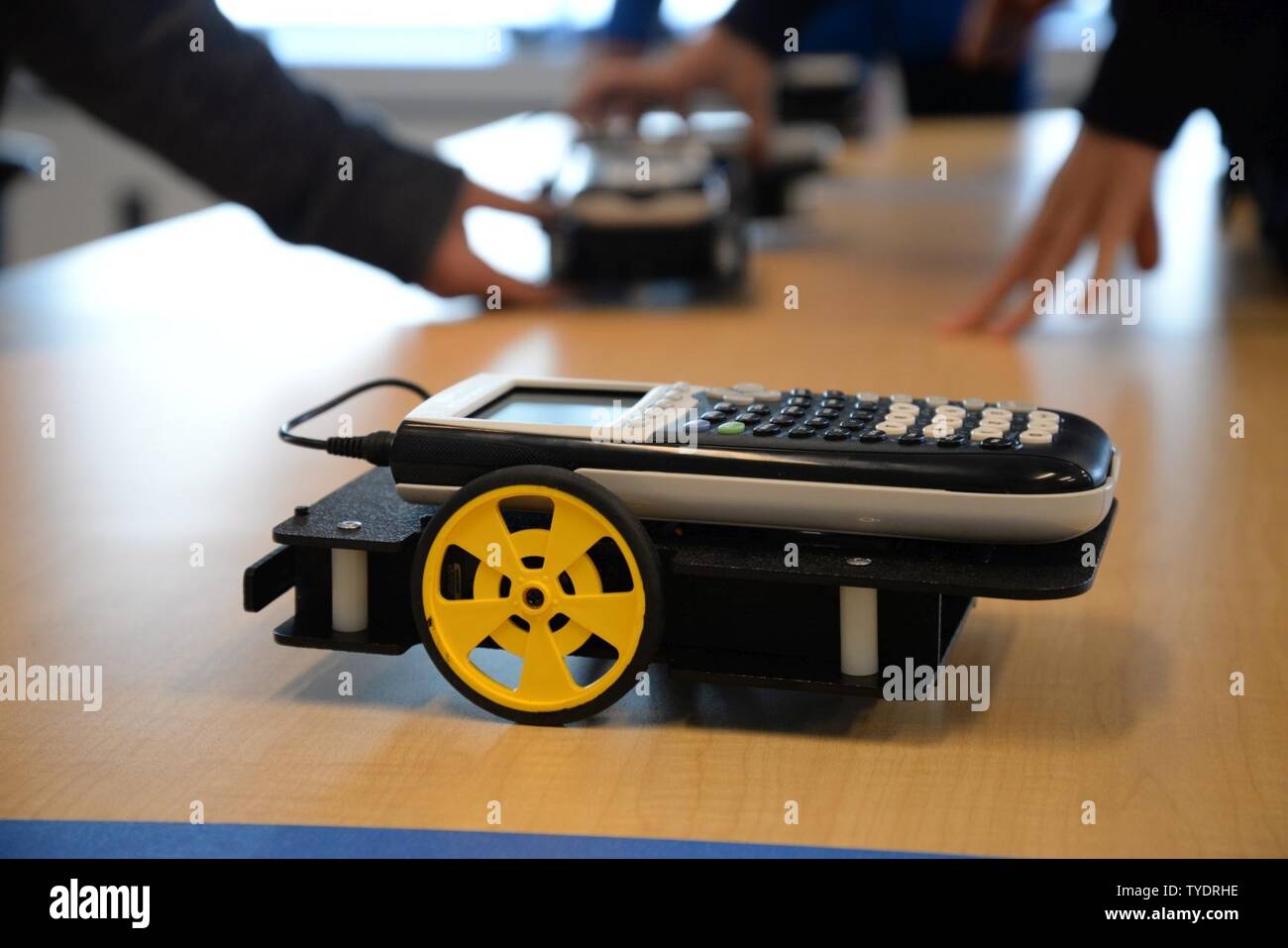 A calculator-controlled robot waits to race with other robots, which ...