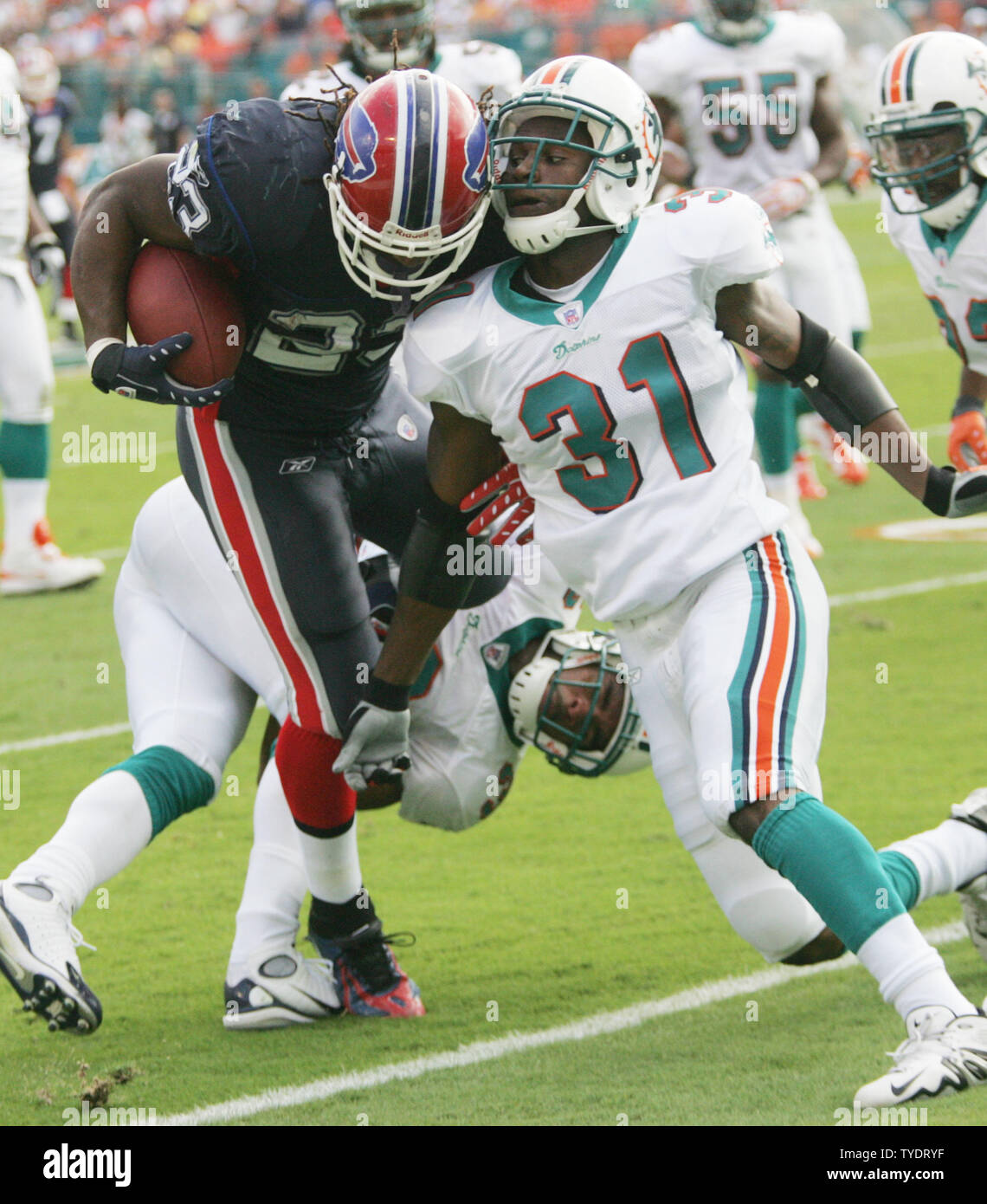 Buffalo Bill Running back Marshawn Lynch (23) is hit by Miami Dolphins ...