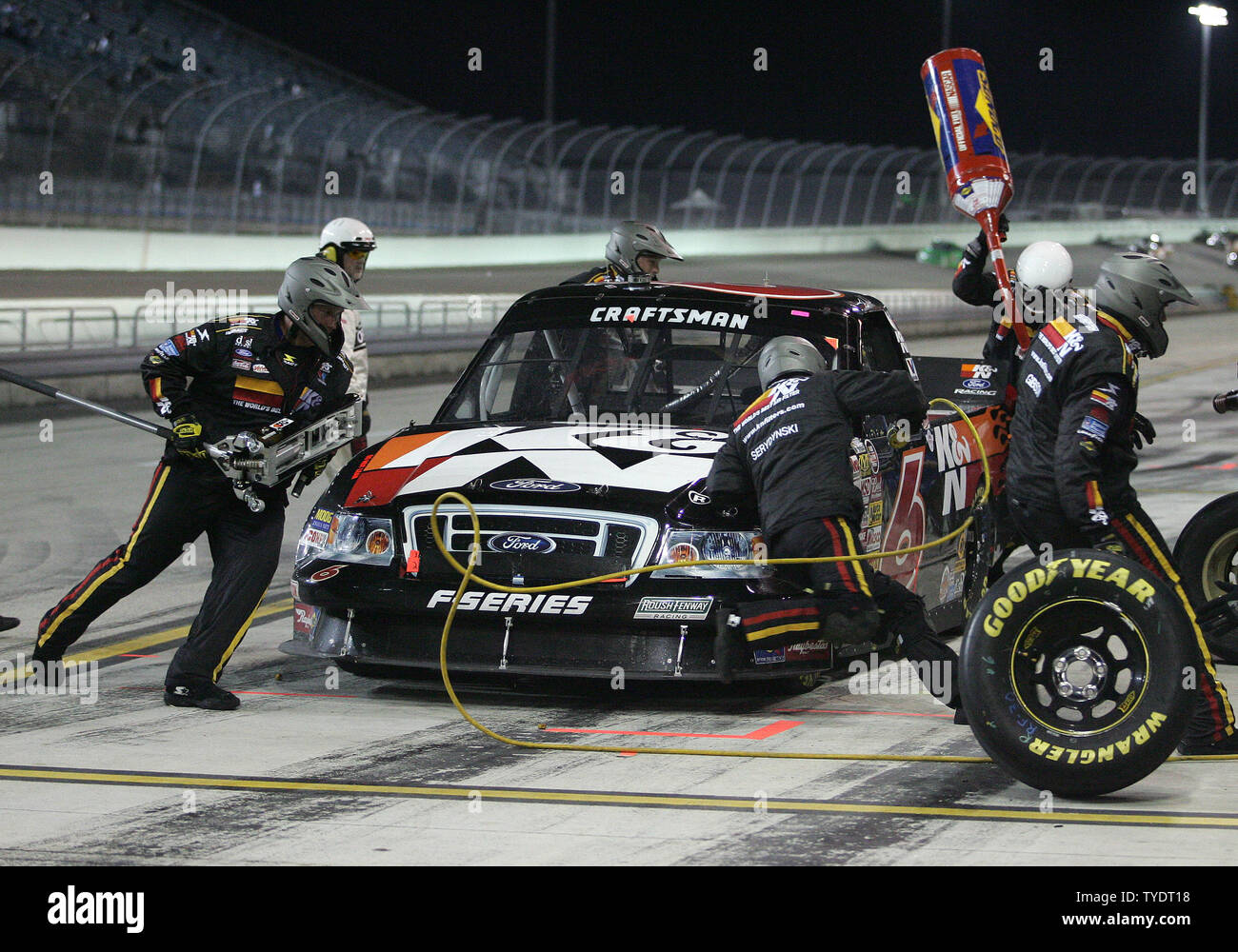 Travis Kvapil pits his car in late race action during the NASCAR ...