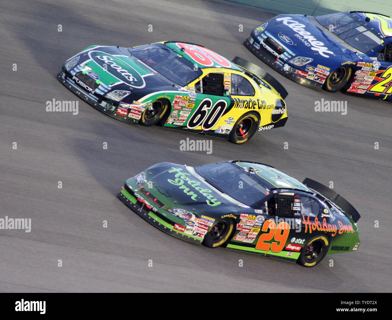 Carl Edwards (60) and Jeff Burton (29) run through turn four during the ...