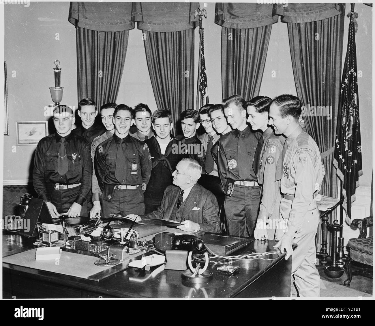 Photograph of President Truman with a group of twelve Boy Scouts who ...