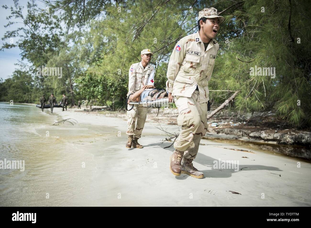 Sailors assigned to the Royal Cambodian Navy transport a wounded ...