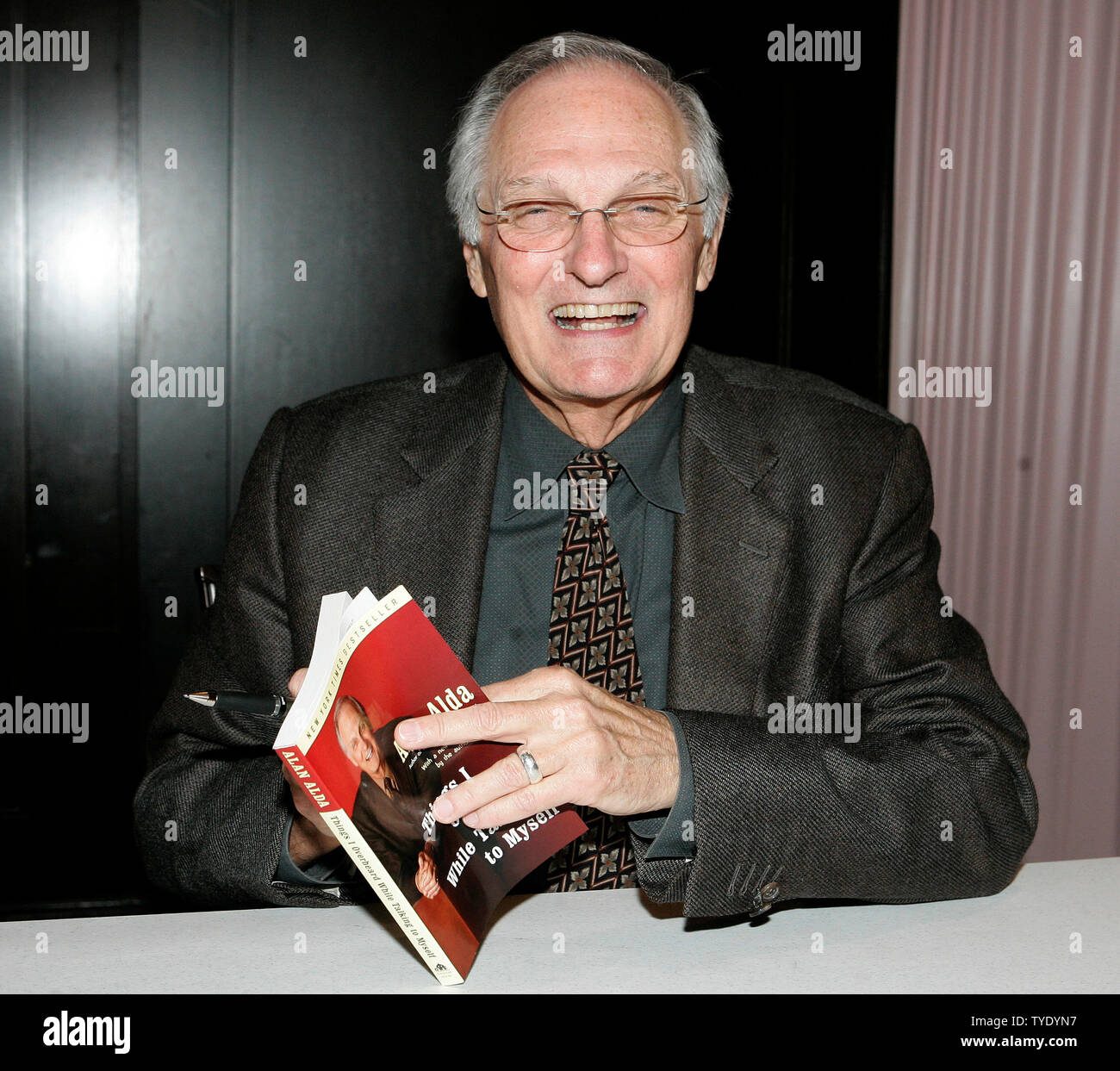 Alan alda signing copies of his book hi-res stock photography and ...