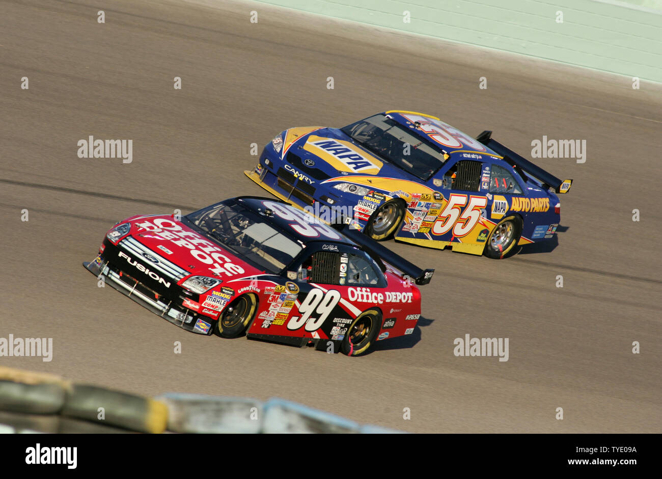 Carl Edwards (99) passes Michael Waltrip during the NASCAR Sprint Cup ...