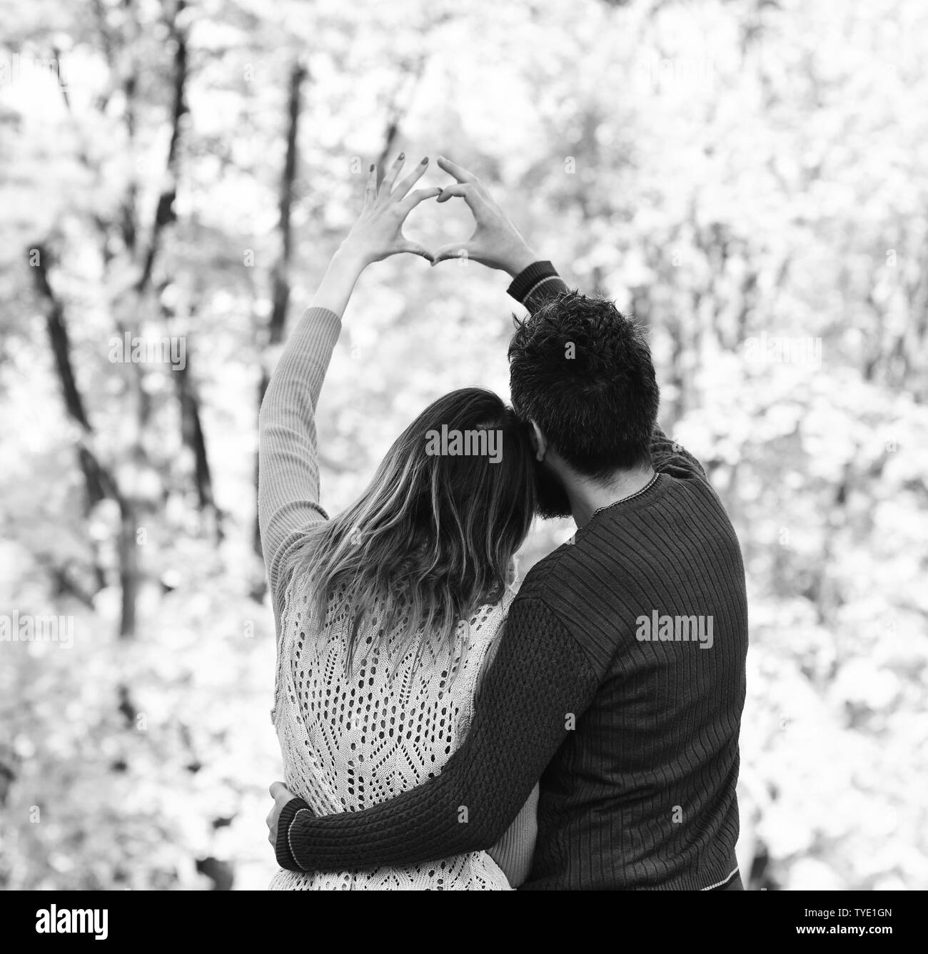 Dating and autumn love concept. Man and woman turned backwards on ...