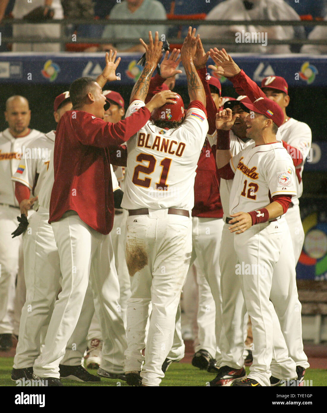 Team Venezuela Henry Blanco celebrates with teammates as he scored in ...